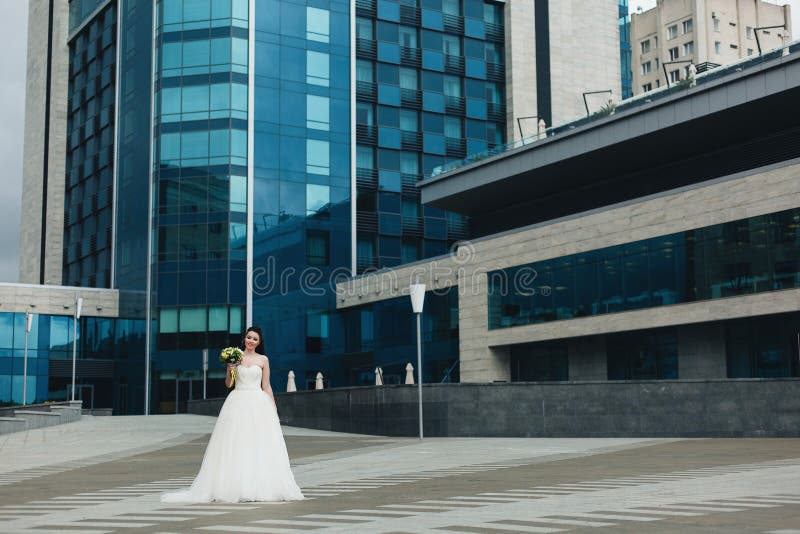 Bride Standing in Front of the High Building Stock Image - Image of ...
