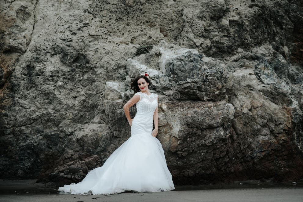 Bride Stands on the Cliff on the Beach Stock Image - Image of lovers ...