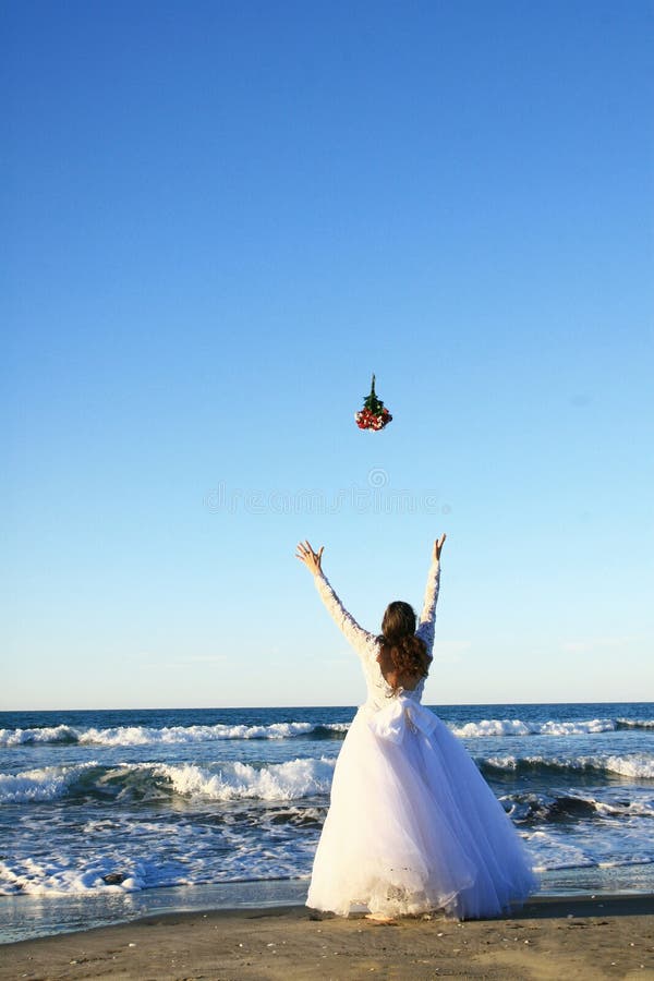 Bride throwing flowers stock image. Image of pink, bridal - 12643875