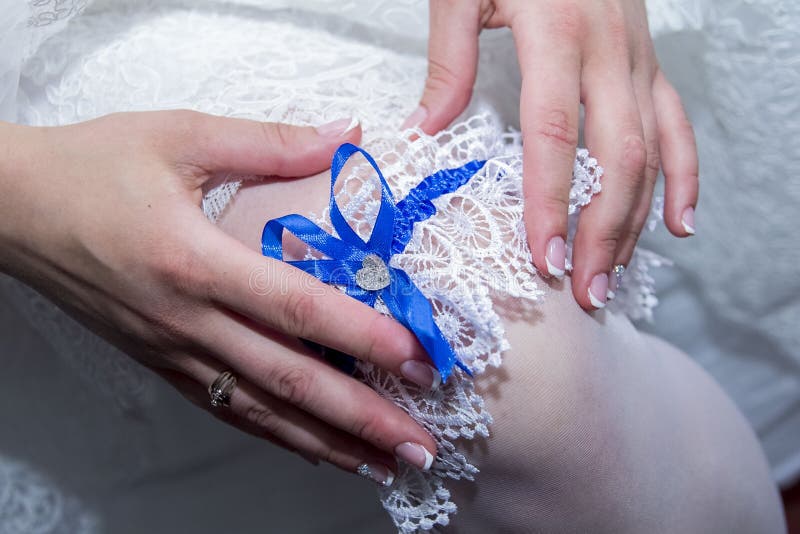 The Bride Wears a Lace White Garter on Her Leg Stock Photo - Image of ...
