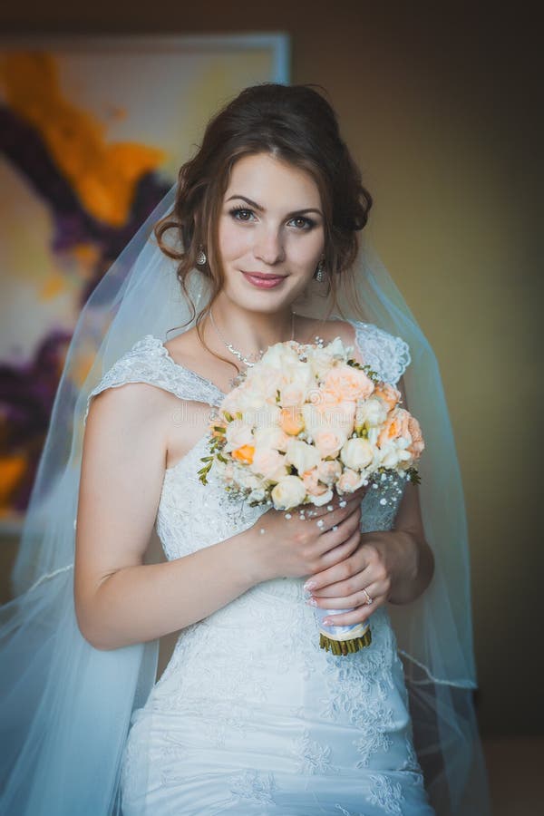 Bride with a Wedding Bouquet Stock Photo - Image of bouquet, morning ...