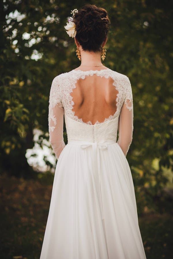 Bride`s back in lace dress stock photo. Image of style - 166110410
