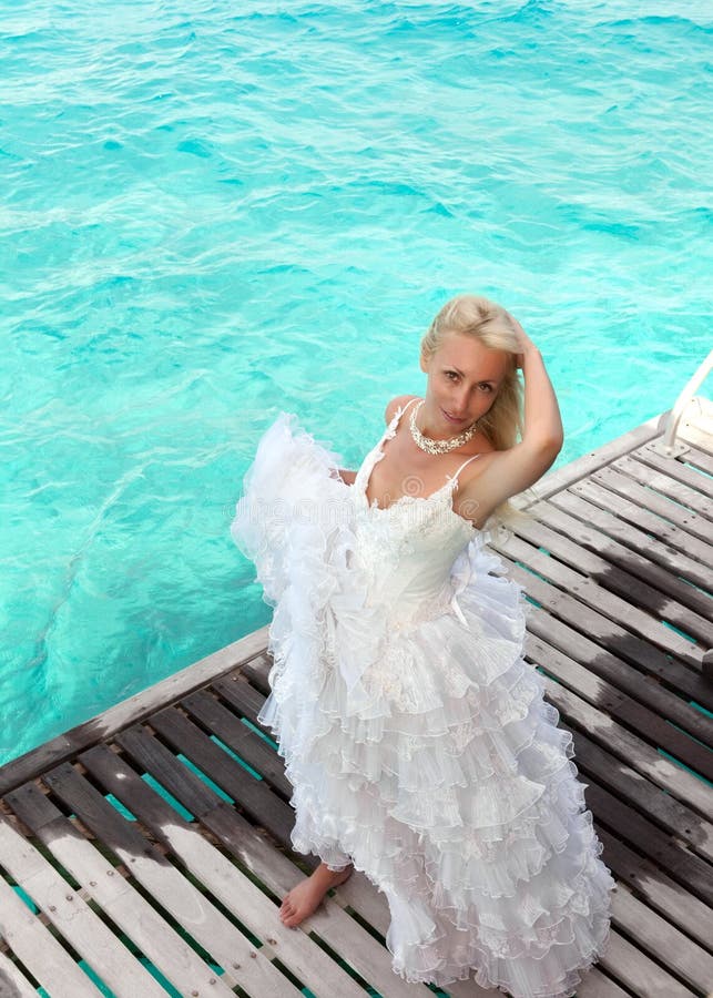 Bride on a Wooden Platform Over the Sea Stock Photo - Image of love ...