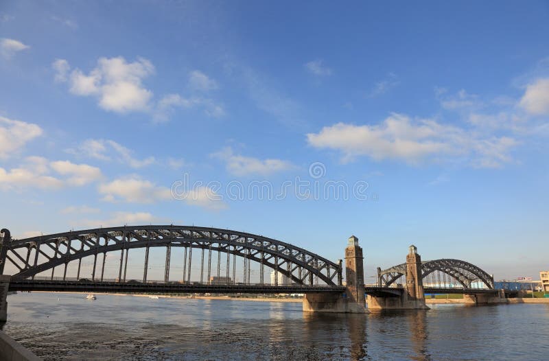 The Red Steel Arch Bridge, Lakes, and Green Woodland Stock Photo ...