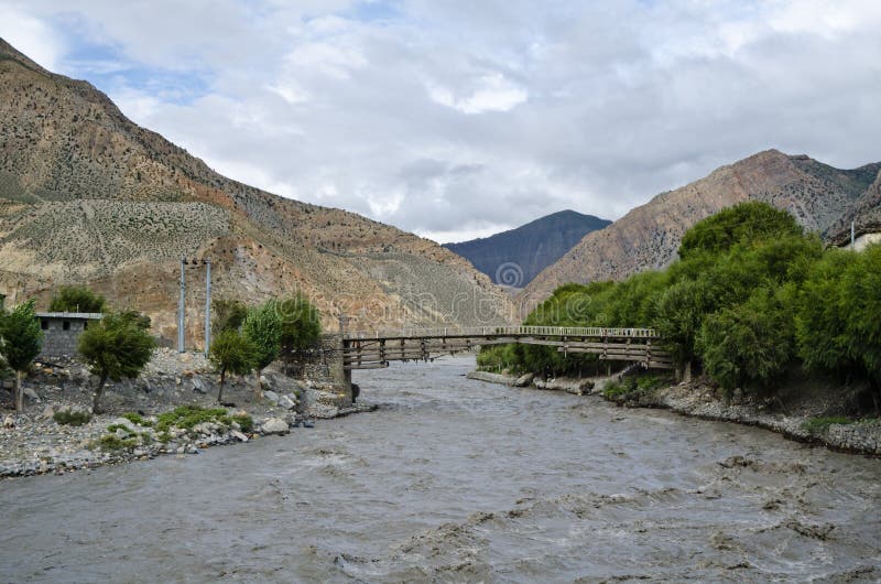 The Bridge Across Affluent Mountain Nepal River Stock Photo - Image of ...