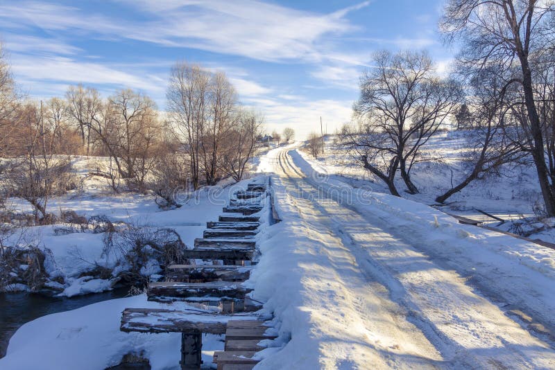 Winter Road Going Over The Horizon. Blue Clouds Above The Road Stock ...