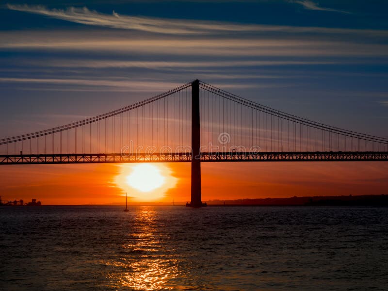Bridge April 25 Over the River Tejo. Sunset in Lisbon. Famous Bridge of ...