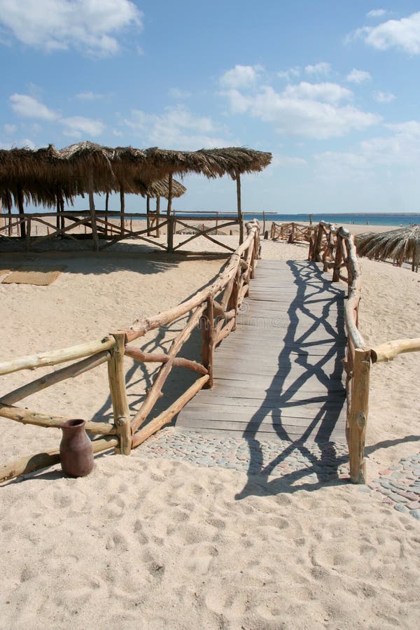 Bridge in the beach stock photo. Image of sunset, clouds - 82319104