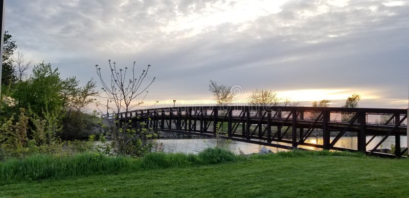 Bridge of Beauty stock photo. Image of lake, water, sunset - 128401512