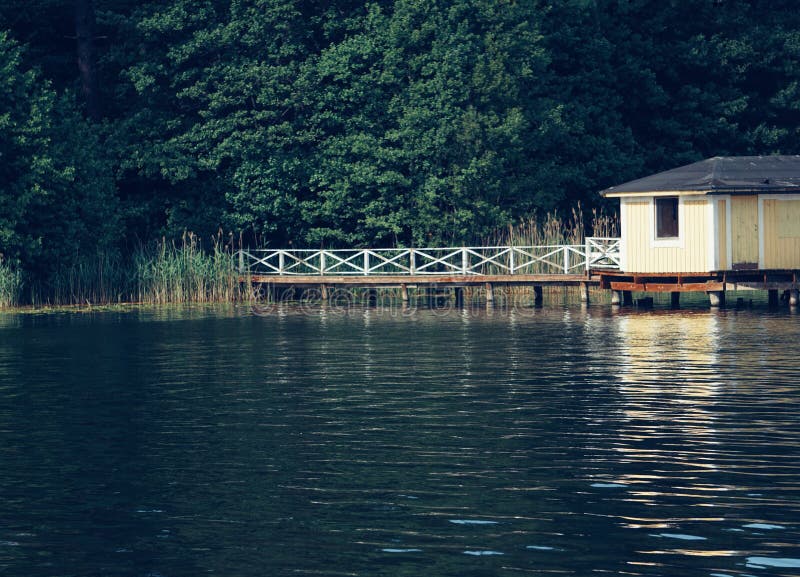 Bridge with boat house stock image. Image of house, river - 249823713