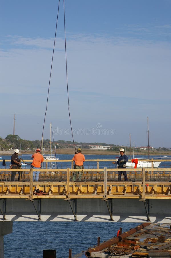 Bridge builders over water stock image. Image of concrete - 490327