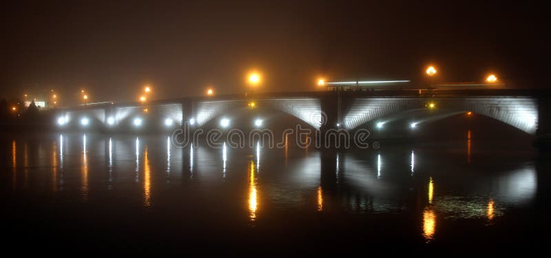 Bridge in fog stock image. Image of night, water, reflections - 475331