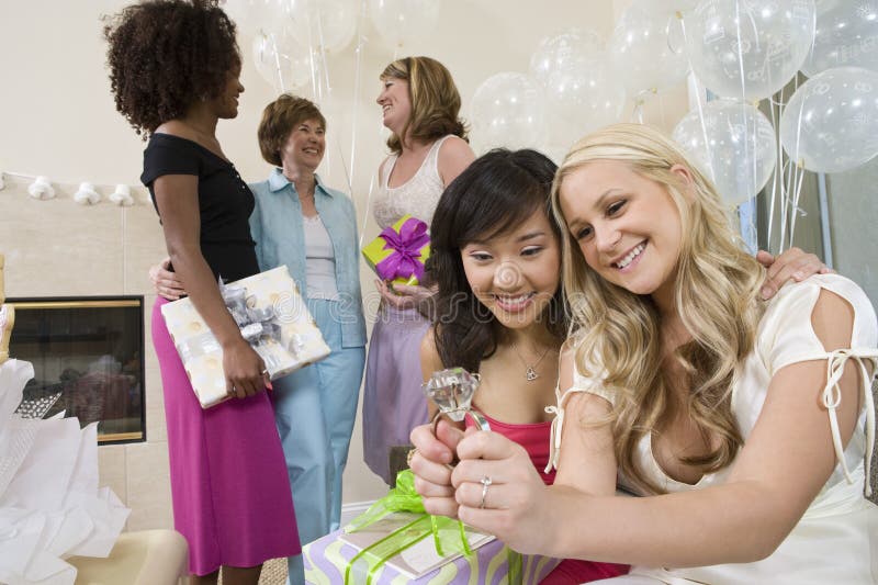 Bridge and Friend Looking at Engagement Ring at Hen Party Stock Photo ...