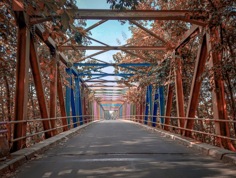 A Bridge that Has a Colorful Truss Bridge. Stock Photo - Image of arch ...
