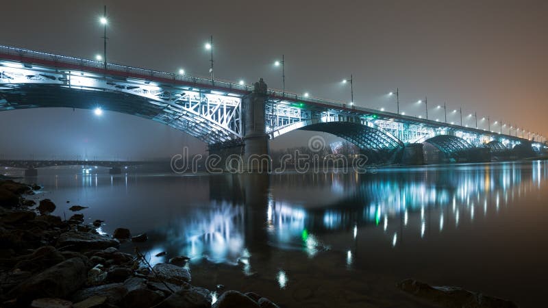 Bridge Illuminated at Night in the Fog Stock Photo - Image of lights ...