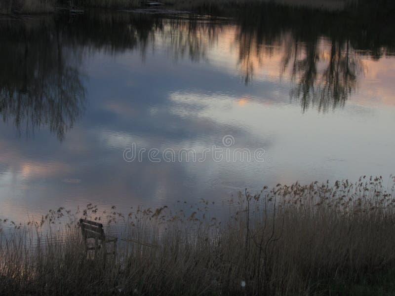 Bridge on the Lake in the Reflection of the Sunset Stock Image - Image ...