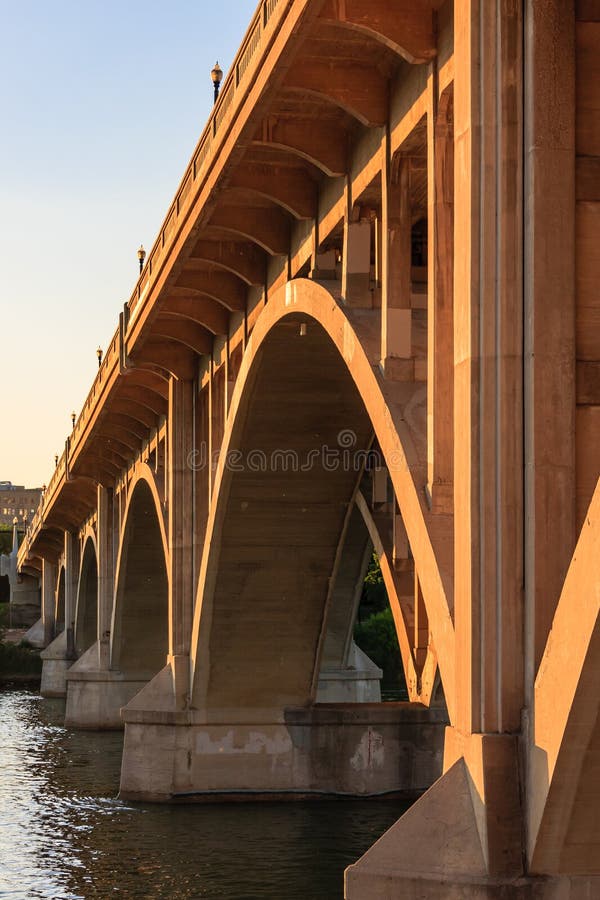 A Bridge with a Large Arch Over a River Stock Photo - Image of large ...
