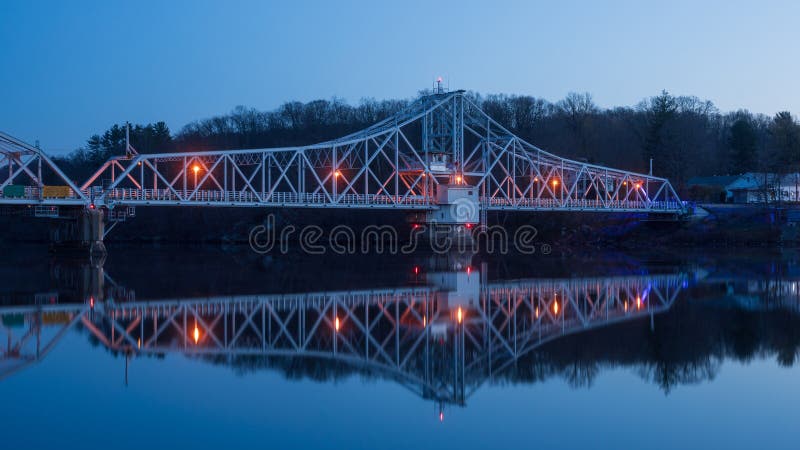 A Bridge with Lights on it is Reflected in the Water Stock Image ...