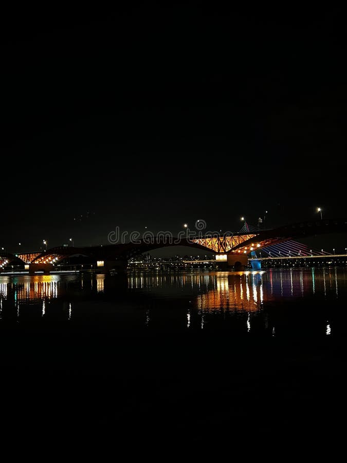The Bridge Lights are Shining in the River. Stock Photo - Image of ...