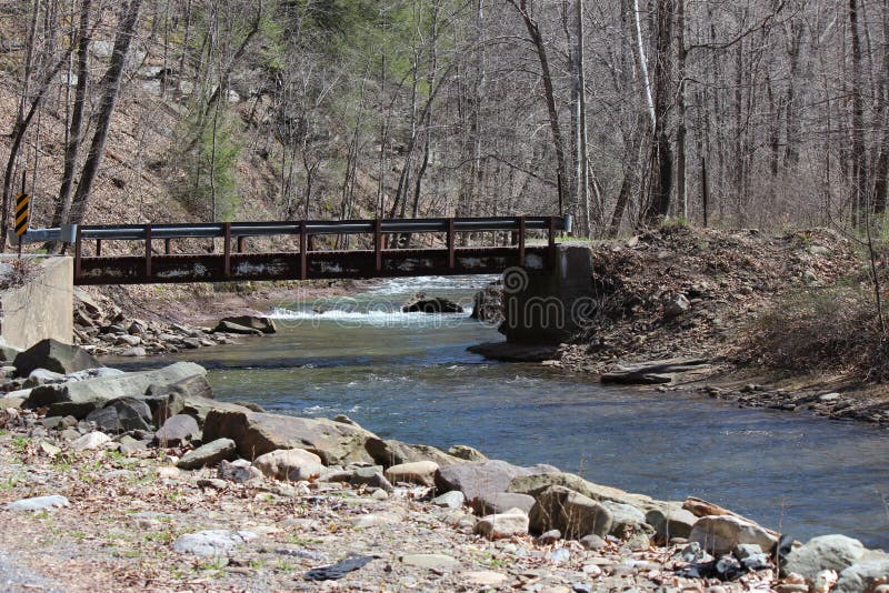 Bridge over creek stock photo. Image of woods, bridge - 63654484
