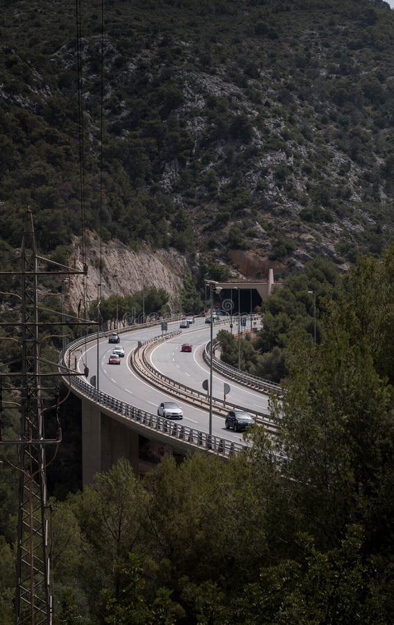 Bridge Over a Highway on a Background of Mountains. Normal Traffic ...