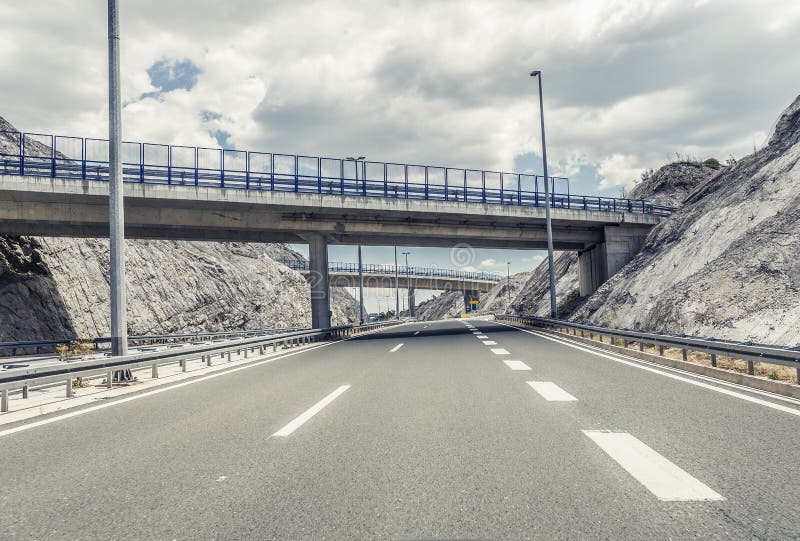 Bridge over a highway. stock image. Image of automotive - 99837669