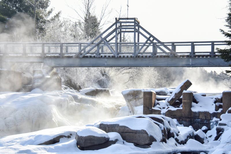 Bridge Over an Icy River in the Canadian Winters in Quebec Stock Photo ...