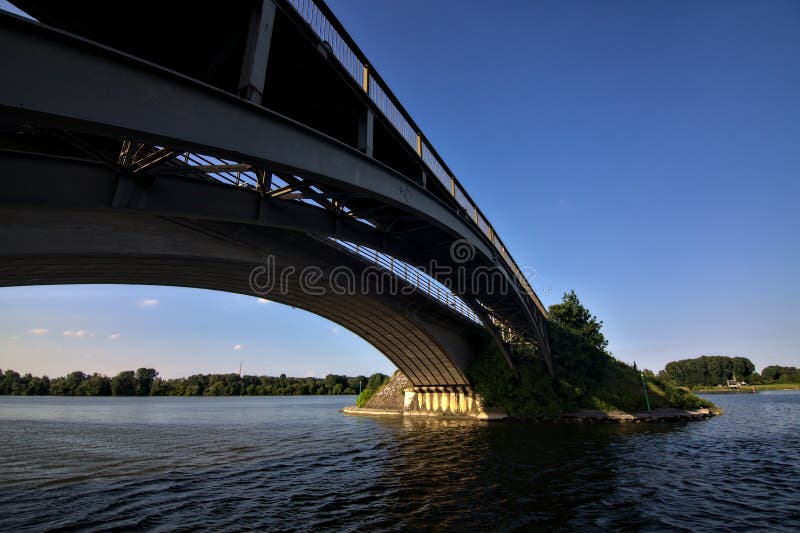 Bridge Over a Lake Seen from Below at Sunset Stock Image - Image of ...