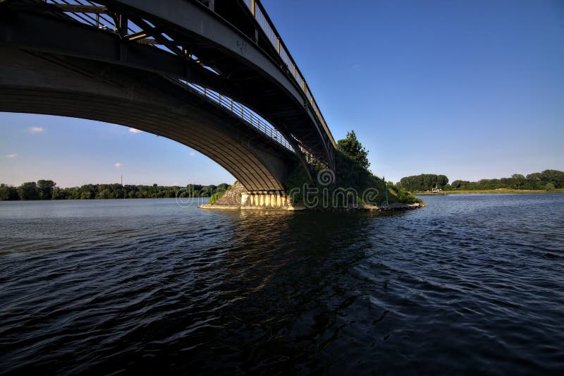Bridge Over a Lake Seen from Below at Sunset Stock Photo - Image of ...