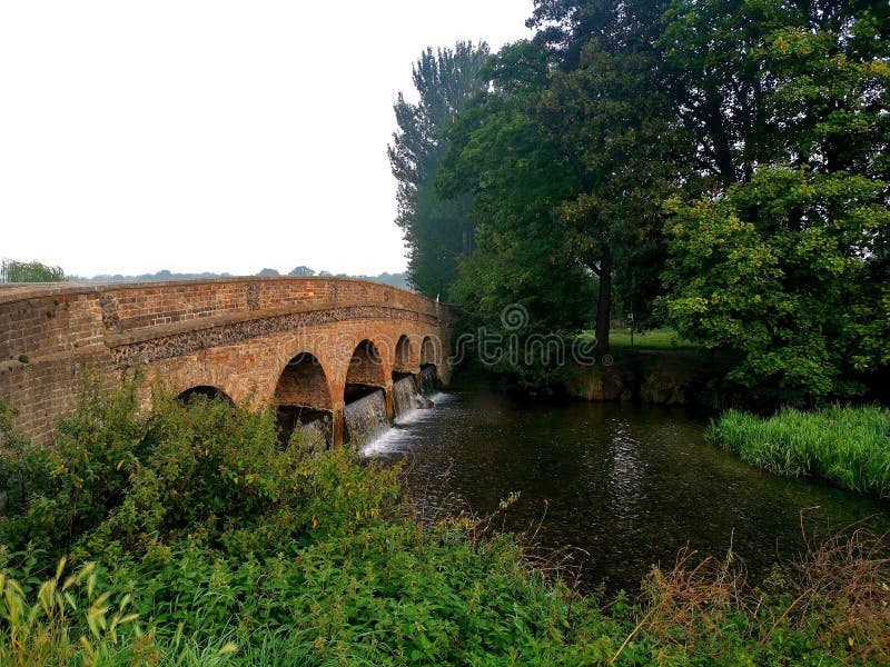 Bridge Over Lake with Sky Reflection Stock Photo - Image of reflection ...
