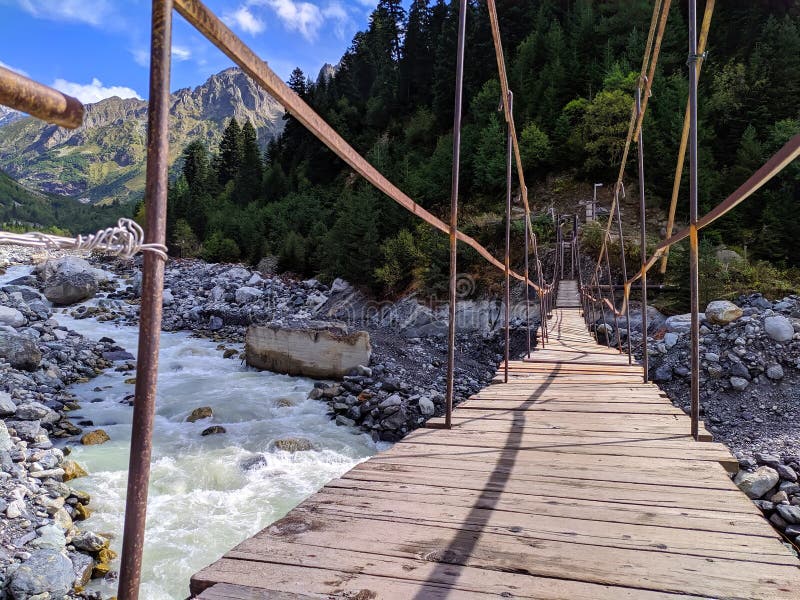 A Bridge Over a Mountain River Stock Image - Image of path, adventure ...