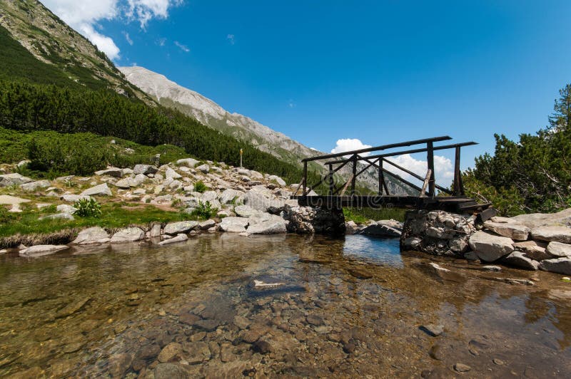 Bridge Over Mountain River stock photo. Image of mountain - 25597480