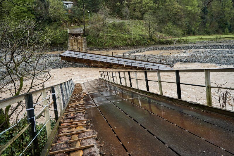 A Bridge Over a Mountain River Destroyed by Water Stock Image - Image ...