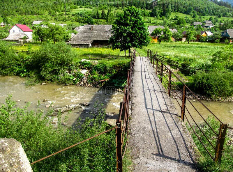 Bridge over mountain river stock image. Image of perfectly - 79616207