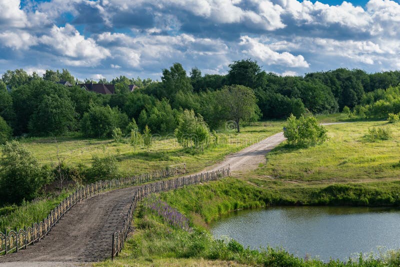 Bridge over the pond stock image. Image of path, green - 129396243