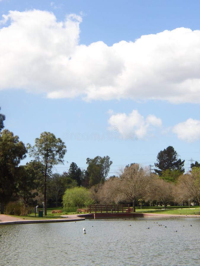 Bridge over pond with sky stock photo. Image of clouds - 50677662