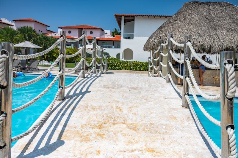 Bridge over the pool stock image. Image of blue, hotel - 242237883