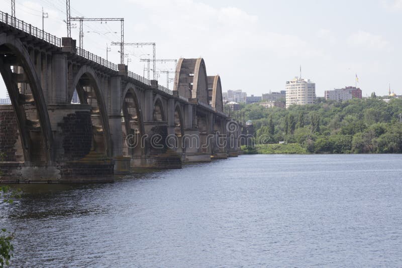 A Bridge Over the River Leads To the City. Train Bridge Stock Image ...