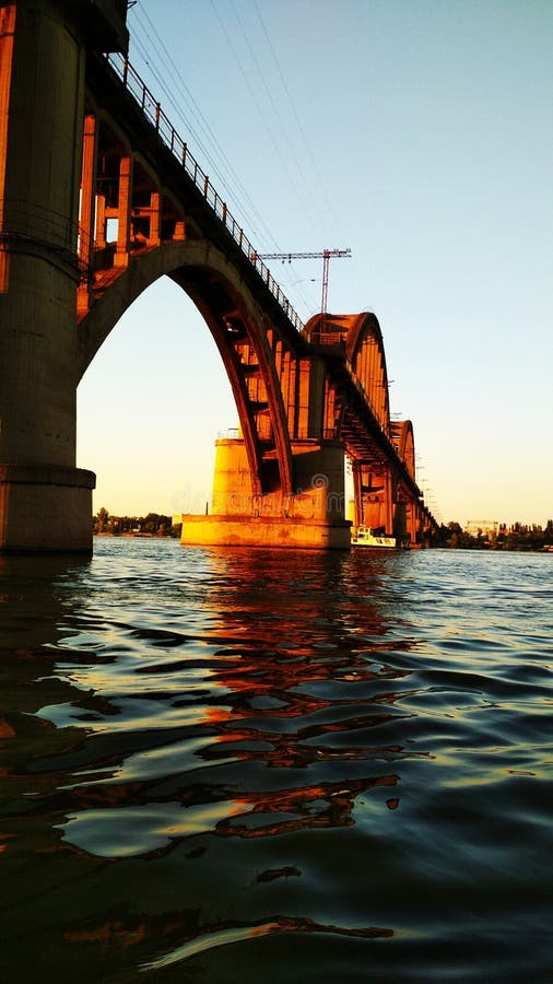 Bridge Over the River on the Sunset Stock Photo - Image of waves ...