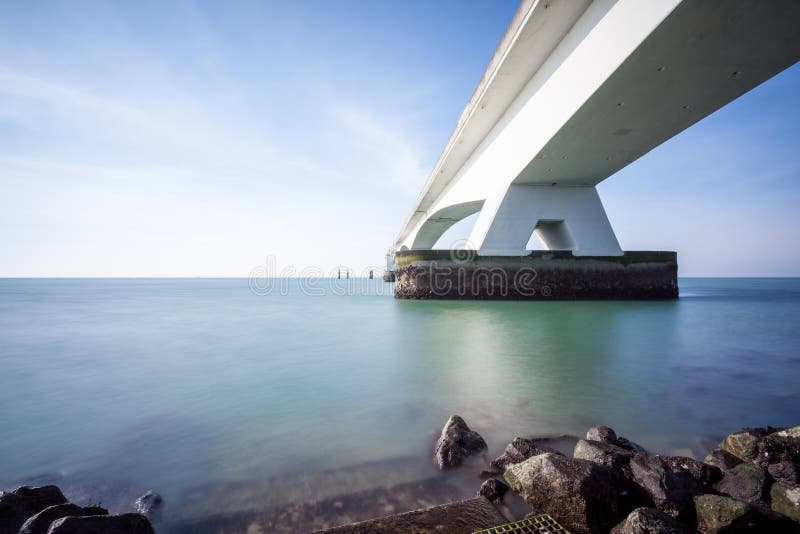 Bridge over the sea stock photo. Image of zeelandbrug - 84603124