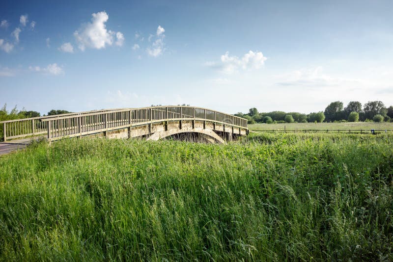 A Bridge Over a Stream in the Countryside, Blue Sky White Clouds Stock ...