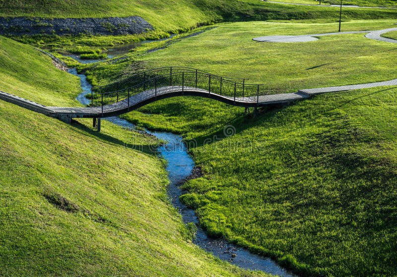 Bridge Over the Stream in the Park Stock Photo - Image of grass ...