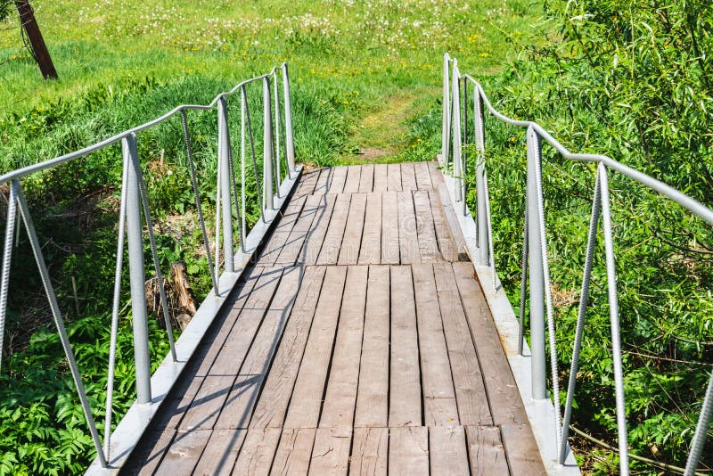 A Bridge Over a Stream in a Village Stock Image - Image of tree, walk ...