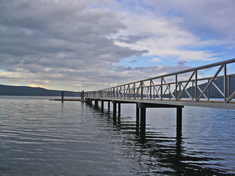 Bridge over water stock photo. Image of clouds, water, walkway - 591832