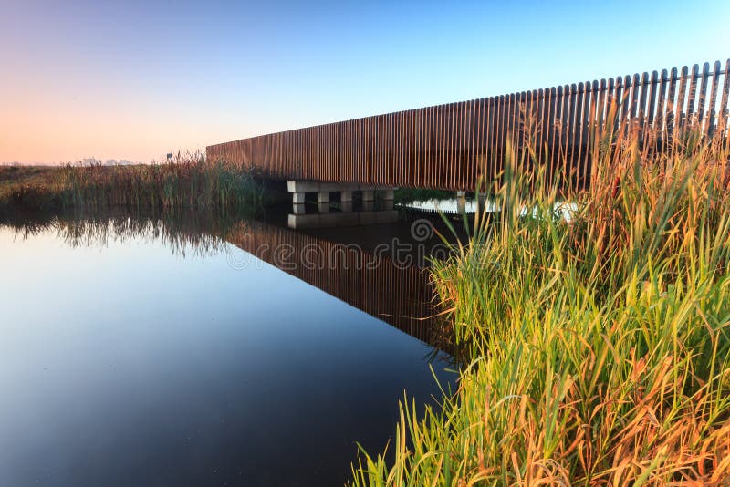 Bridge Over Water in Early Morning Light Stock Photo - Image of ...