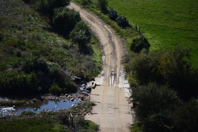 Bridge Over Water Stream with Fresh Waters Over the Road Stock Image ...