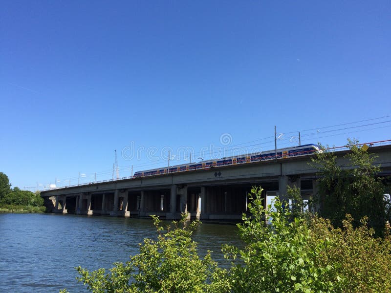 Bridge Over Water with Train Stock Image - Image of train, reservoir ...