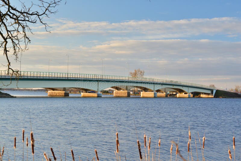 Bridge Over a Wide River and Lagoon at Sunrise, Picturesque Clouds in ...