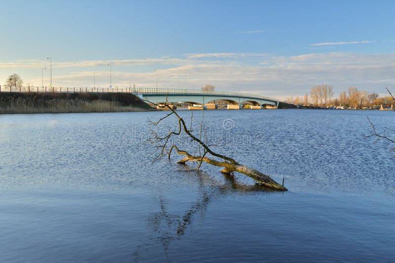 Bridge Over a Wide River and Lagoon at Sunrise, Picturesque Clouds in ...