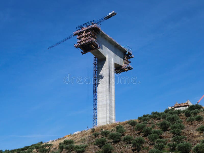 Bridge Pillar Under Construction with Crane in Action Under Blue Sky ...